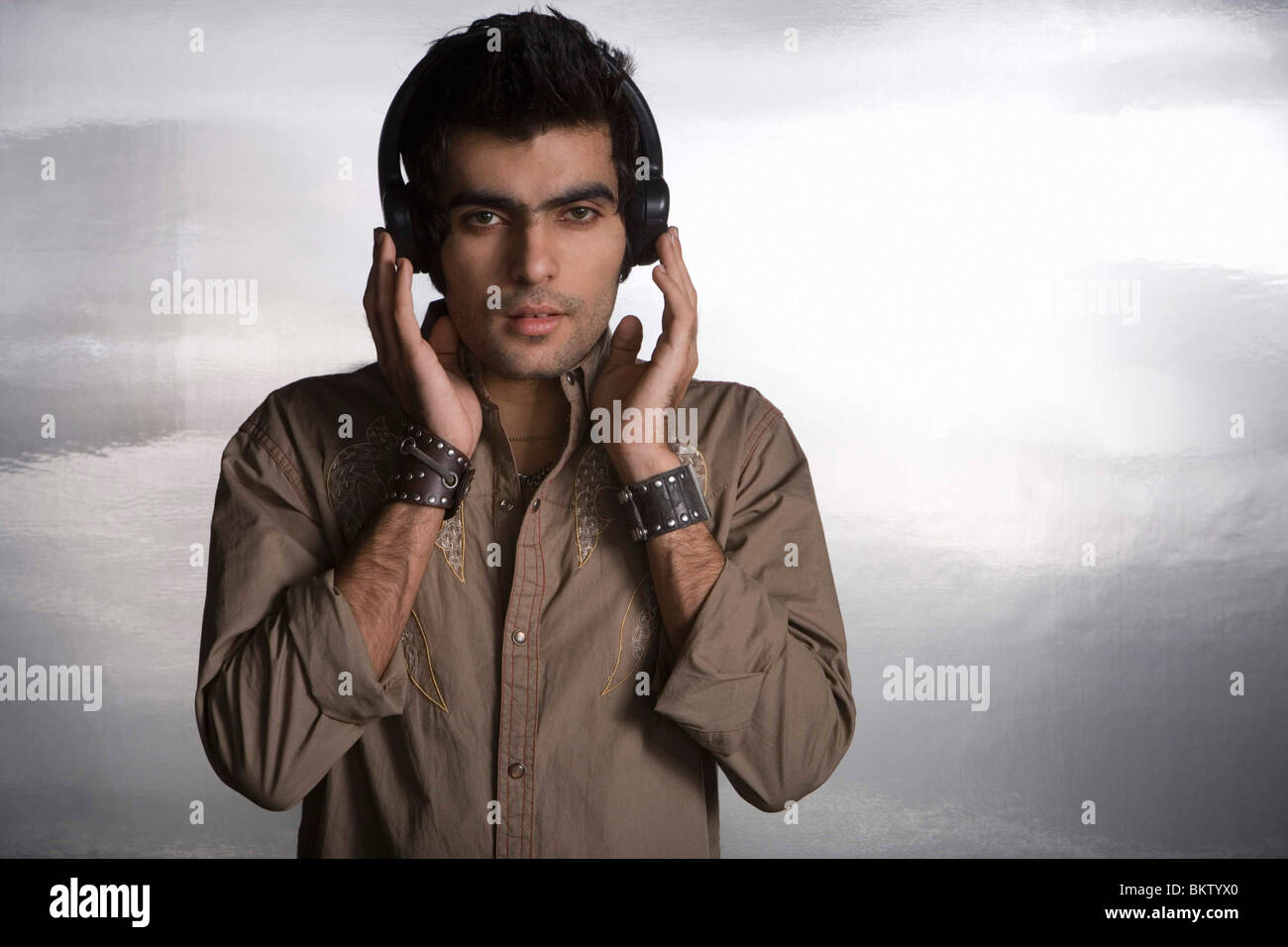 Young man listening to music, portrait Stock Photo - Alamy