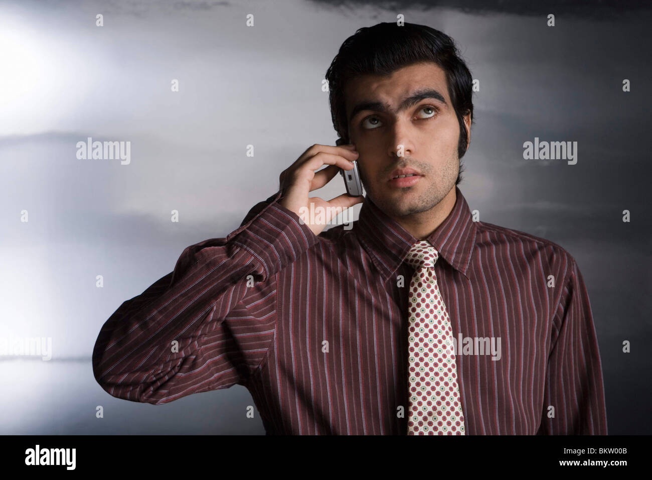 Young man using mobile phone, portrait Stock Photo - Alamy