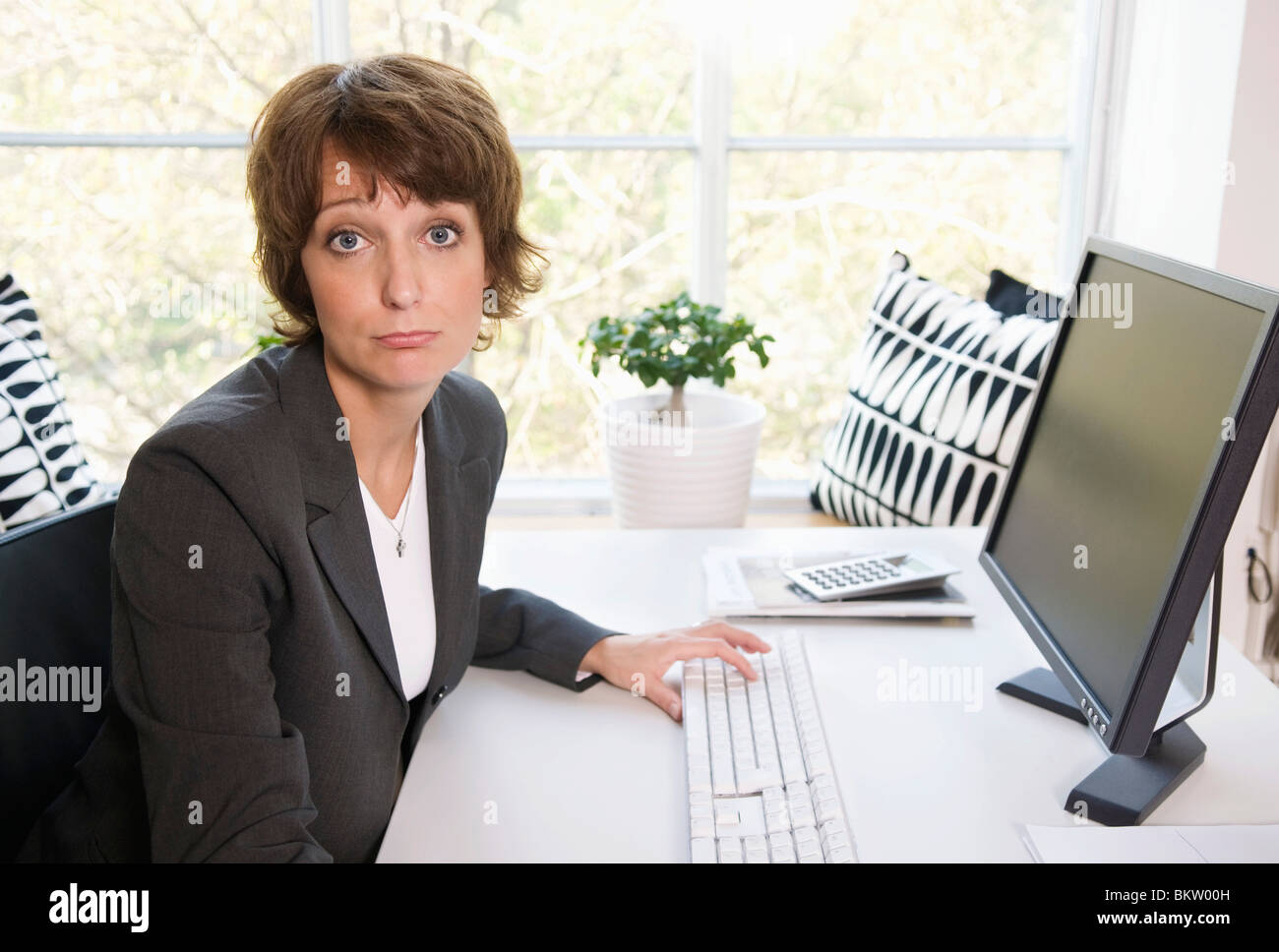 Middle-aged woman at work Stock Photo - Alamy