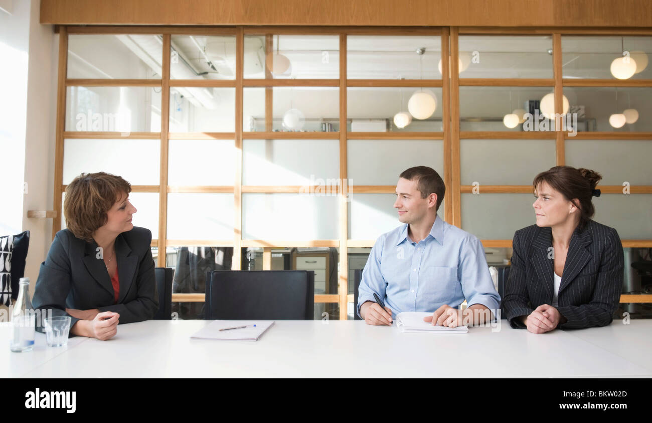 Three people in meeting Stock Photo - Alamy