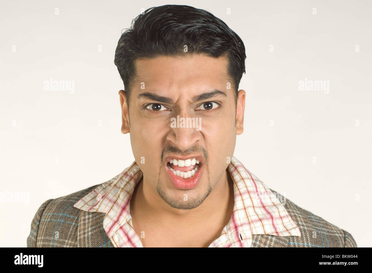 Mid adult man showing anger, portrait Stock Photo - Alamy
