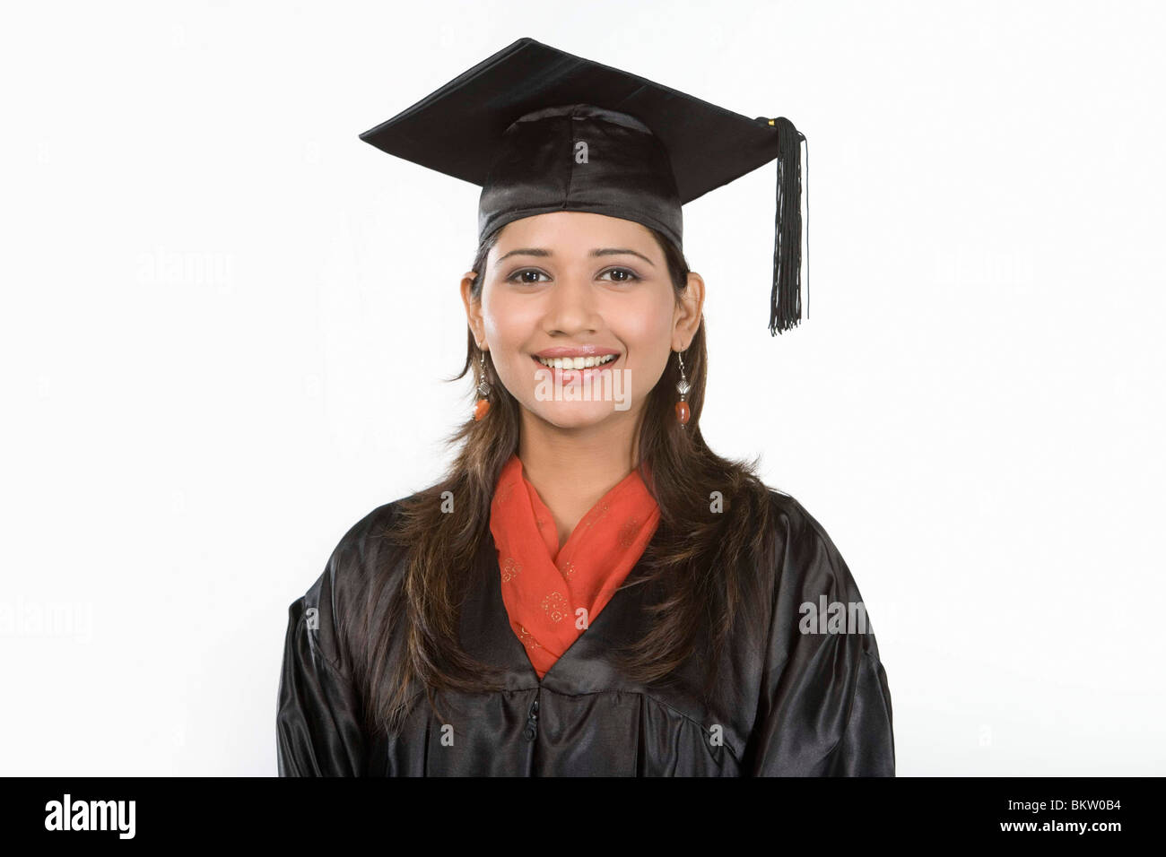 Young woman wearing mortar board, smiling, portrait Stock Photo - Alamy