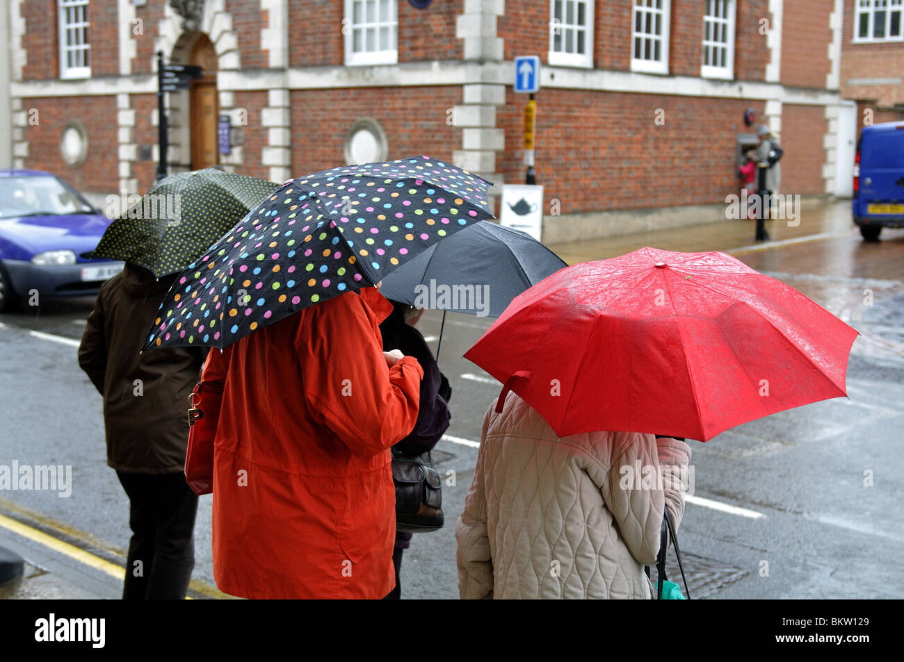 People carrying umbrellas Stock Photo - Alamy