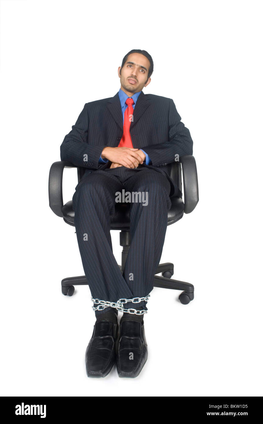 Business man tied chair Cut Out Stock Images & Pictures - Alamy