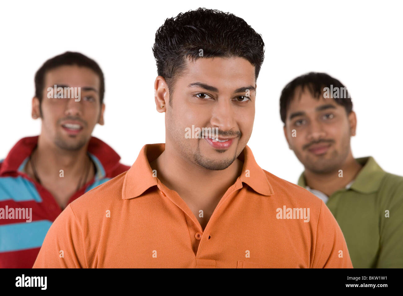 Friends smiling against white background, portrait Stock Photo - Alamy