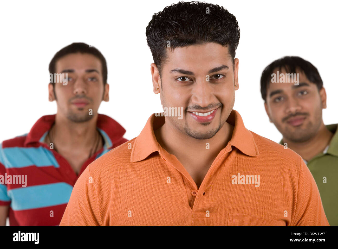 Friends smiling against white background, portrait Stock Photo - Alamy