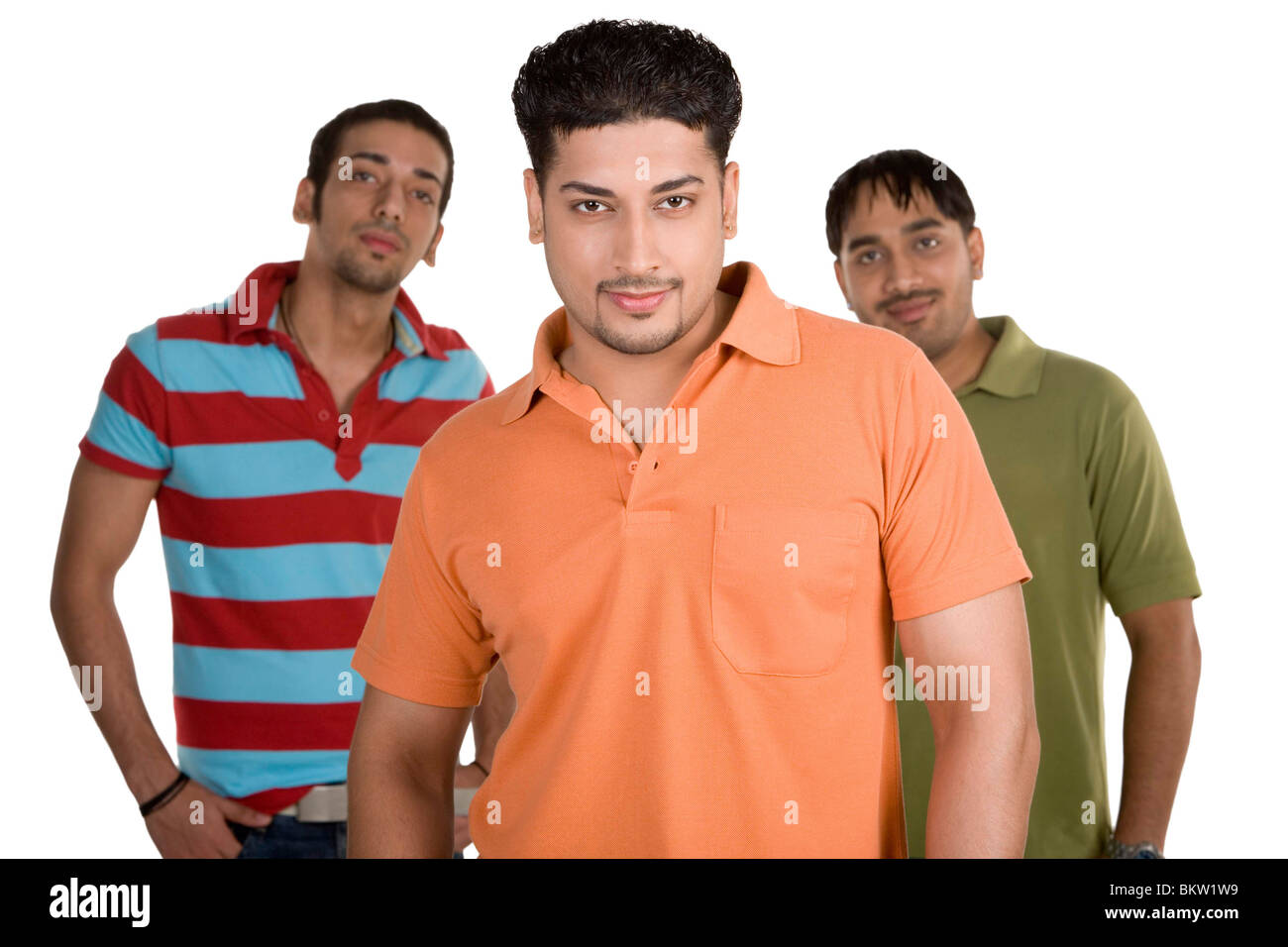 Friends smiling against white background, portrait Stock Photo - Alamy