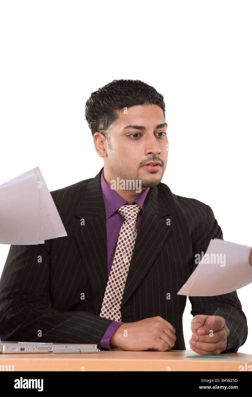 Businessman receiving documents Stock Photo - Alamy