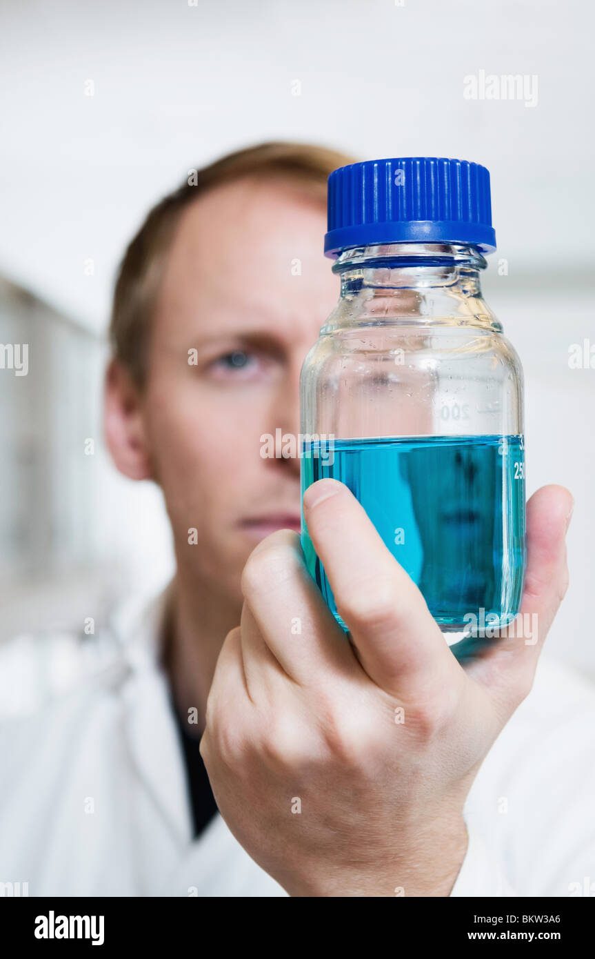 Man holding test of substance Stock Photo - Alamy