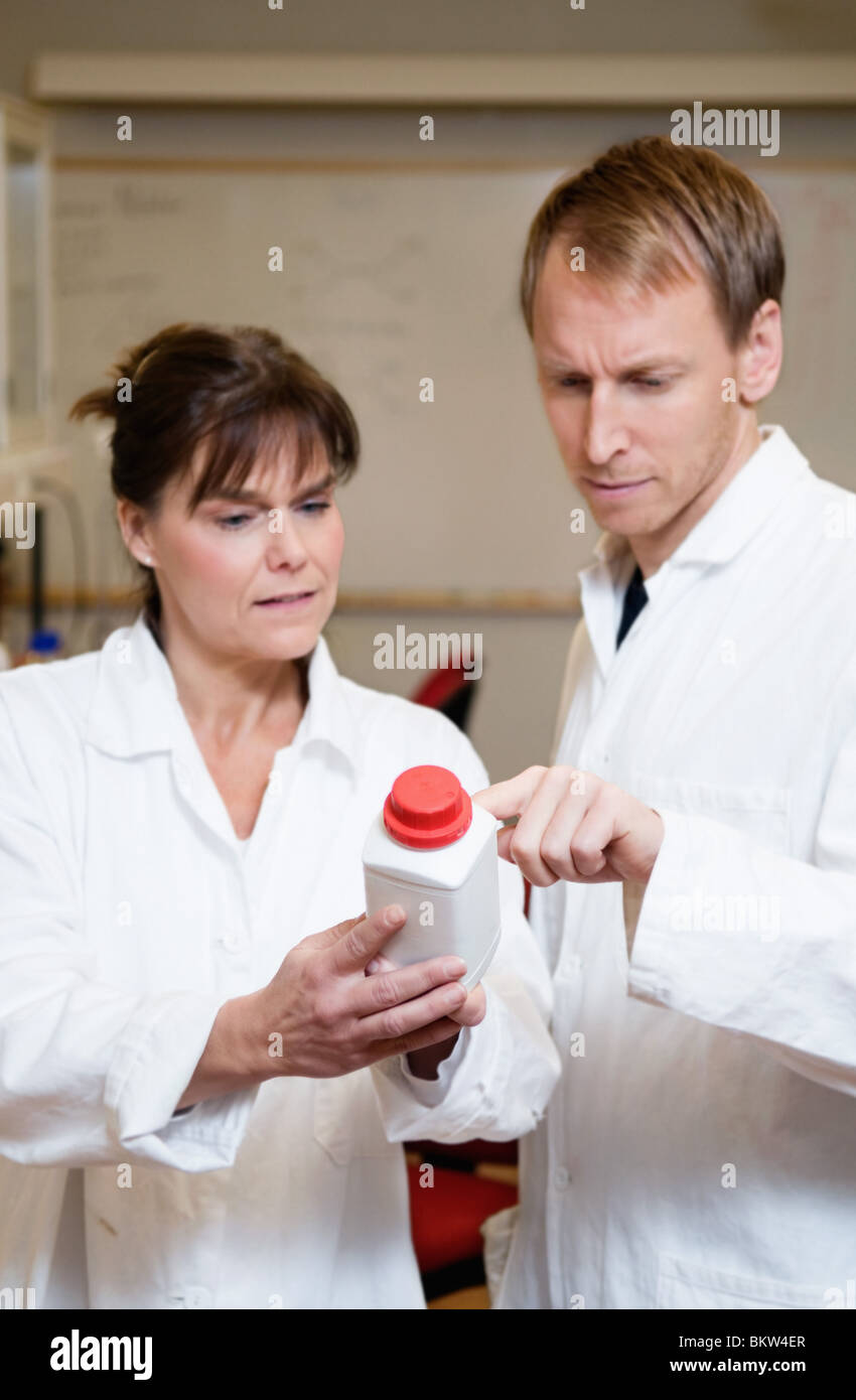 doctors looking at medicine Stock Photo - Alamy