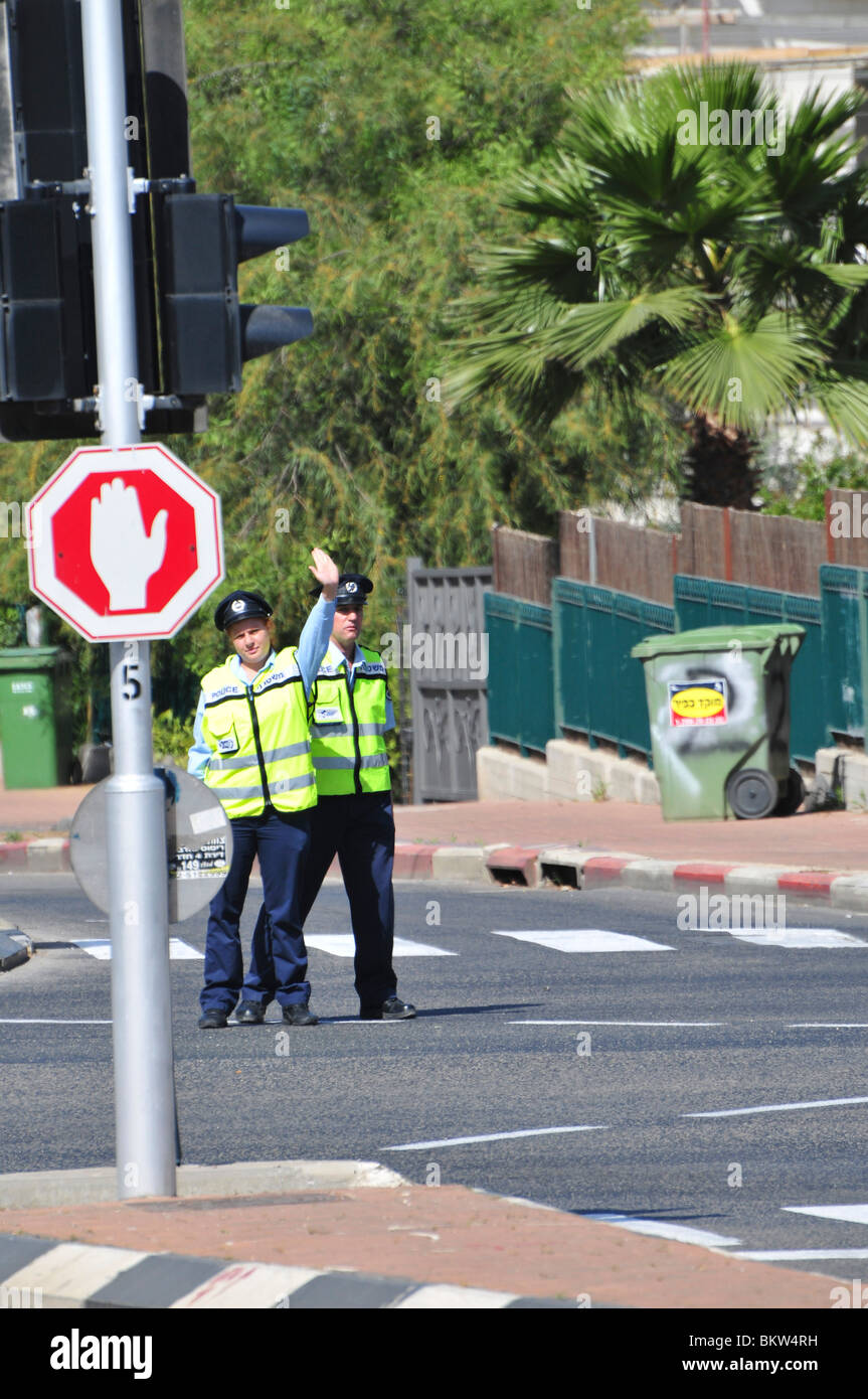 Israel, Traffic Cop directs traffic flow in an intersection Stock Photo ...