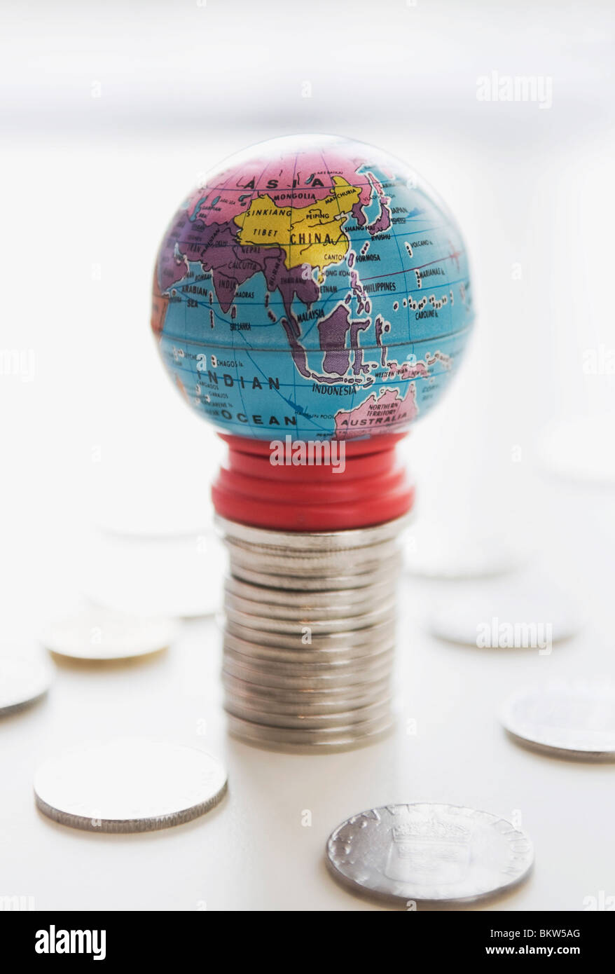 Earth and coins Stock Photo - Alamy