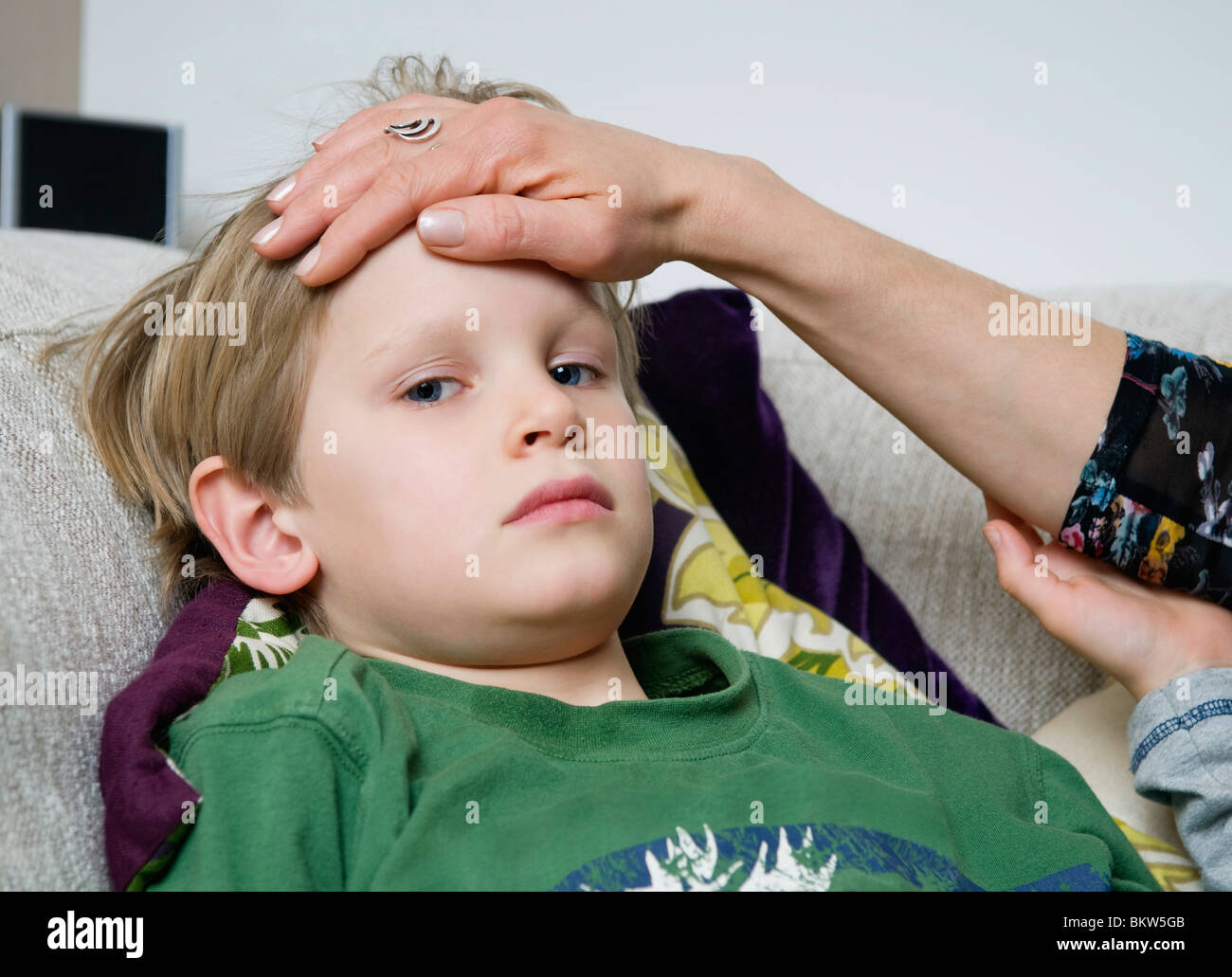 Boy with fever Stock Photo - Alamy