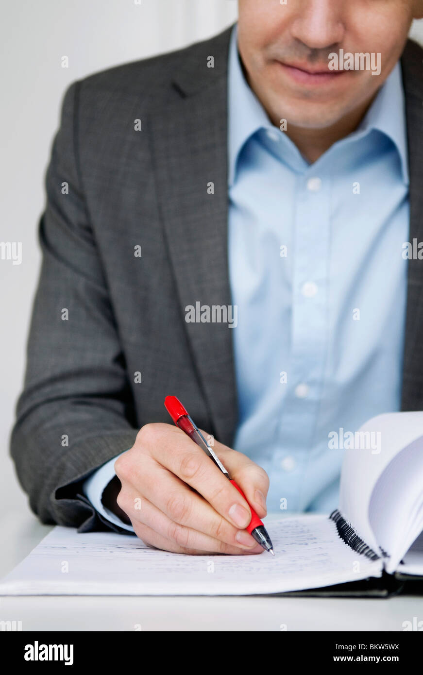 Man taking notes Stock Photo - Alamy
