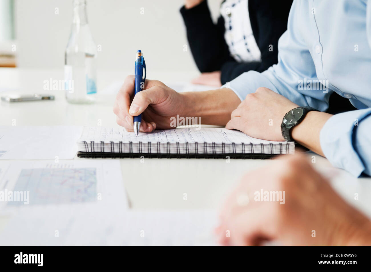 Writing in notebook Stock Photo - Alamy