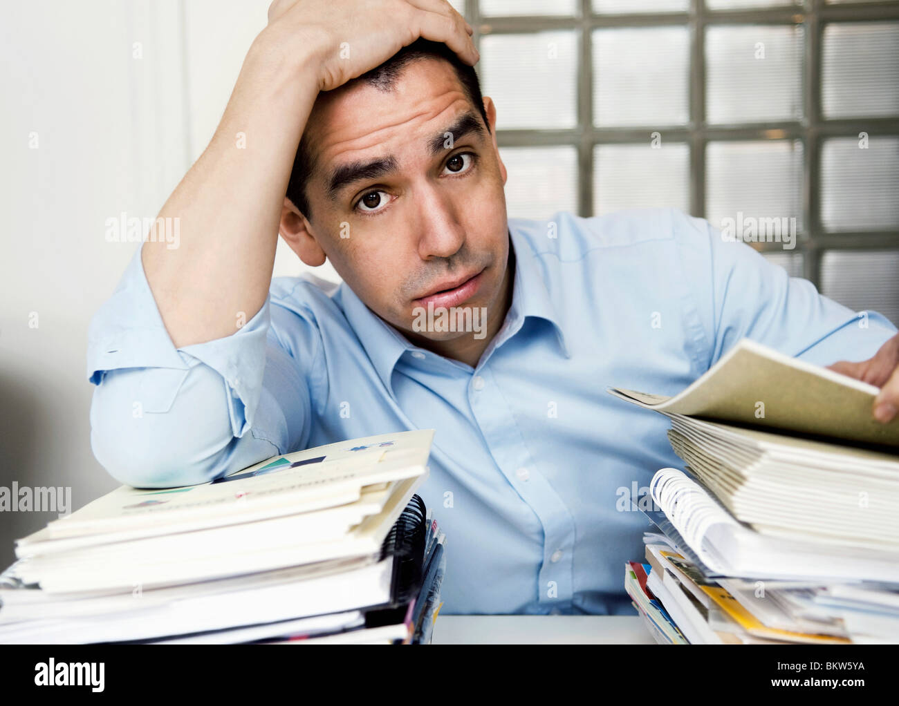 Man with lot of work Stock Photo - Alamy