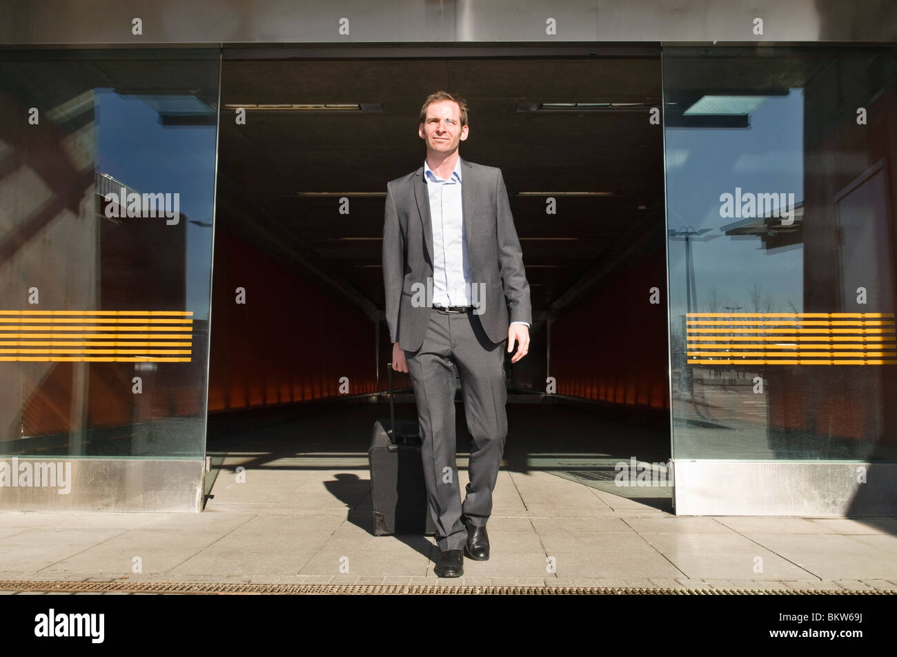 People walking out from door hi-res stock photography and images - Alamy