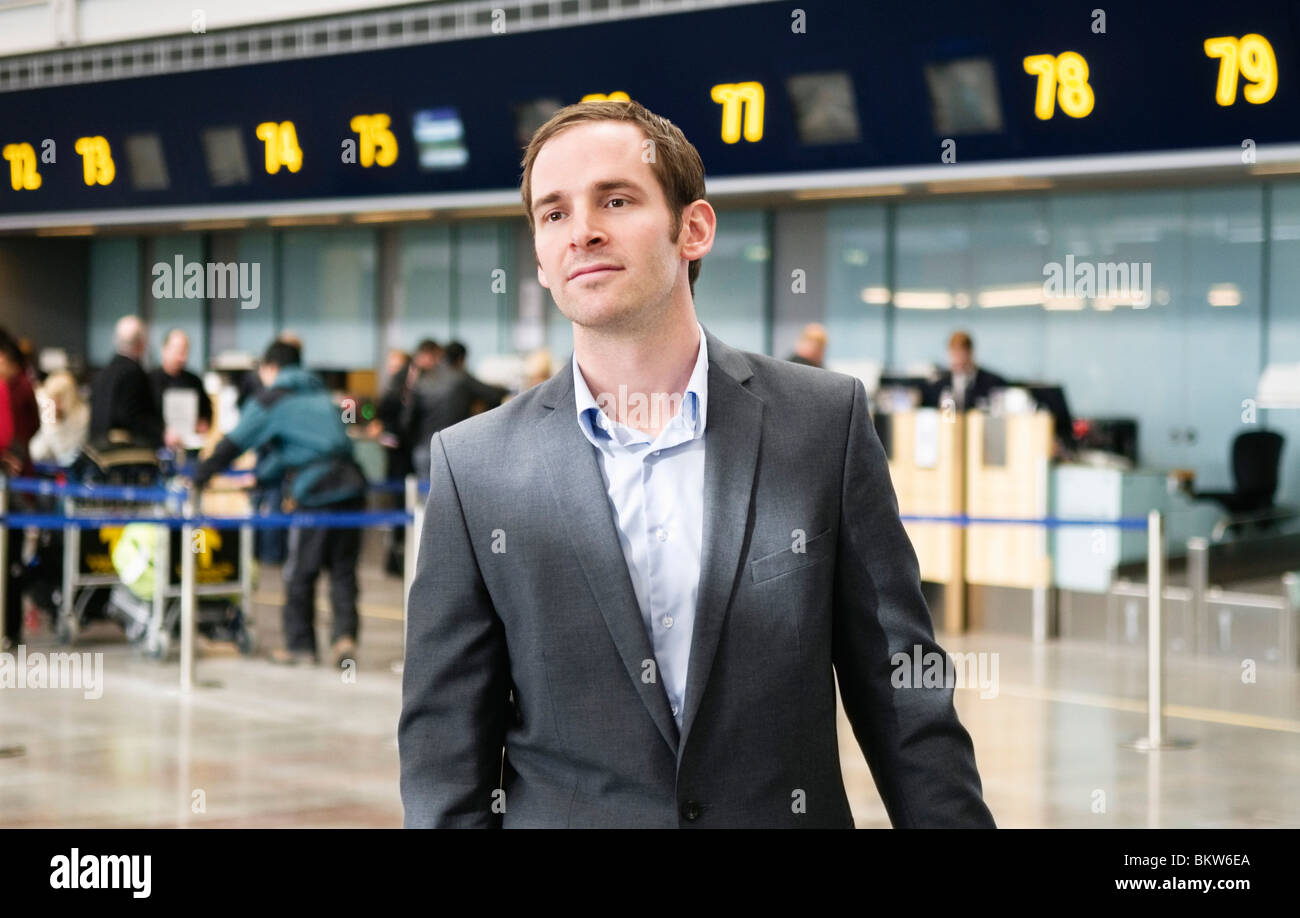 Man by check-in Stock Photo - Alamy