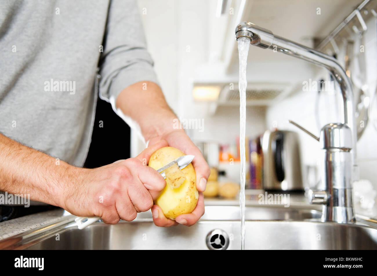 Man peeling potato hi-res stock photography and images - Alamy