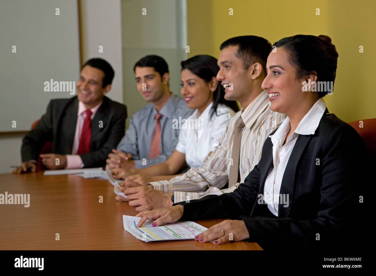 Five businesspeople in a conference room Stock Photo - Alamy