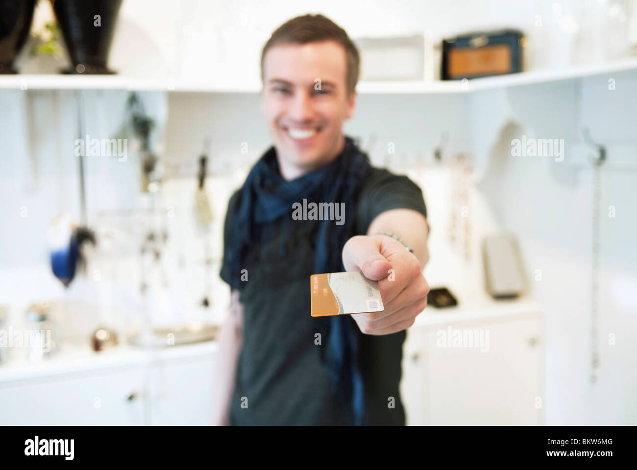 Man giving credit card Stock Photo - Alamy