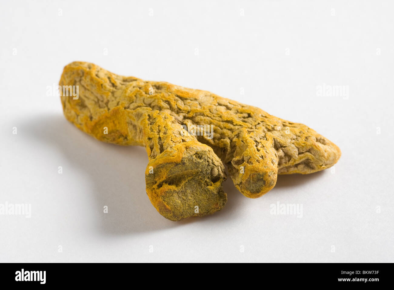 One turmeric root Stock Photo - Alamy