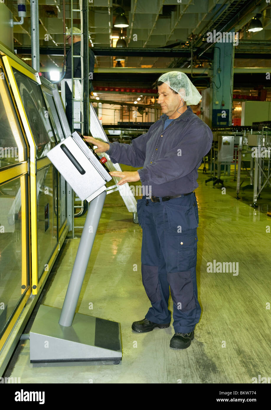 Man standing by dashboard Stock Photo - Alamy