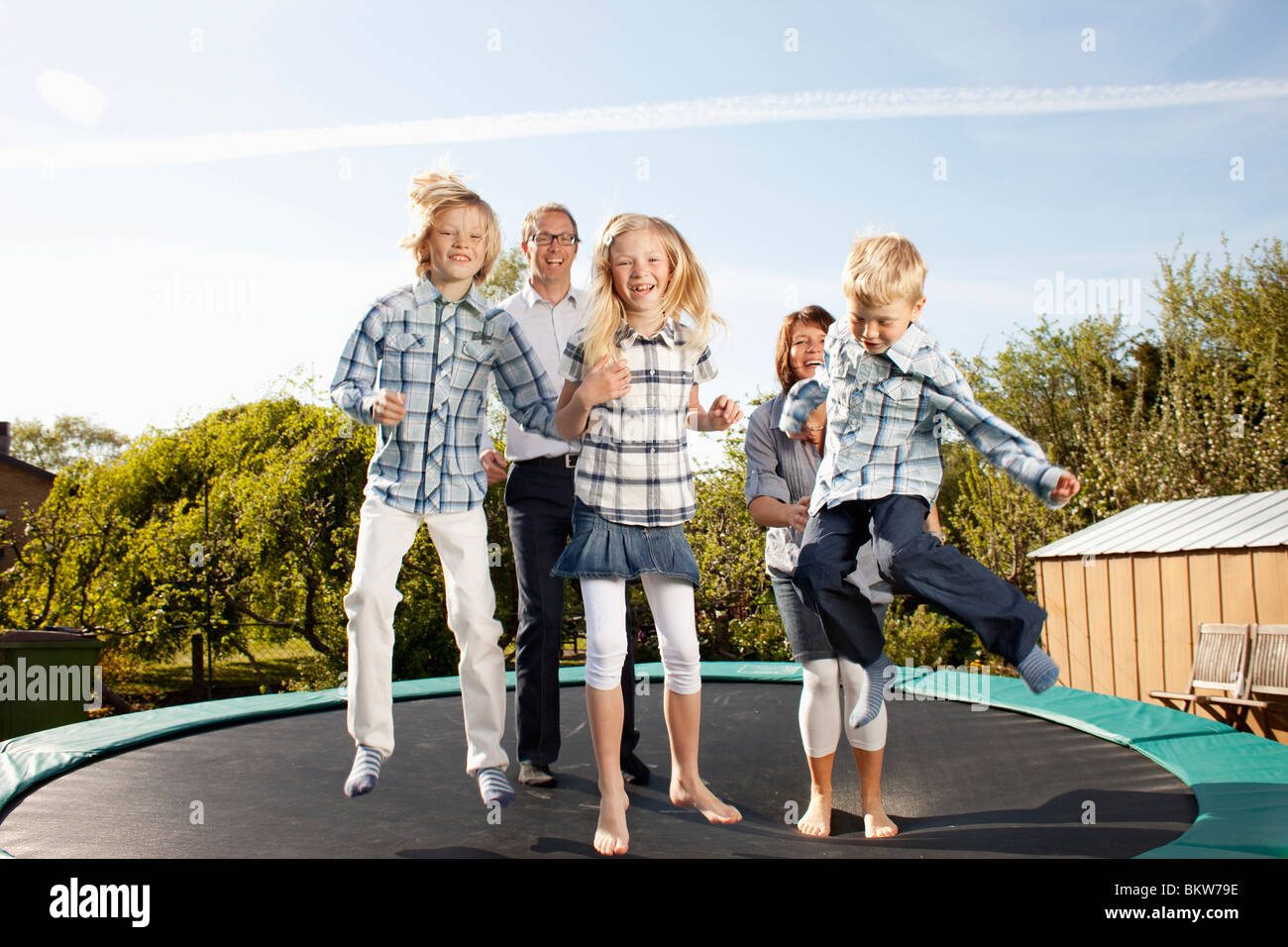 Mother daughter jumping trampoline hi-res stock photography and images ...
