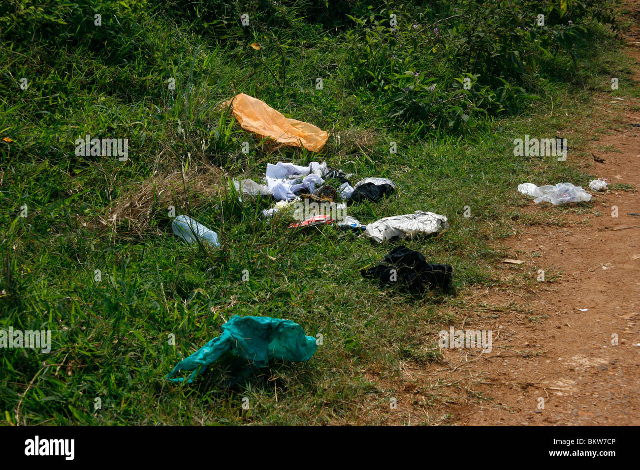 Discarded rubbish littering a roadside Stock Photo - Alamy
