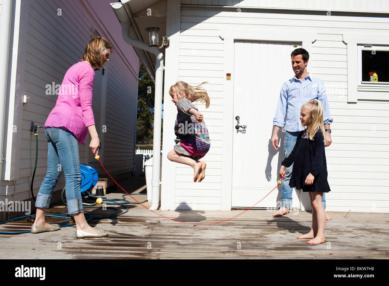 Girl jumping the rope Stock Photo - Alamy