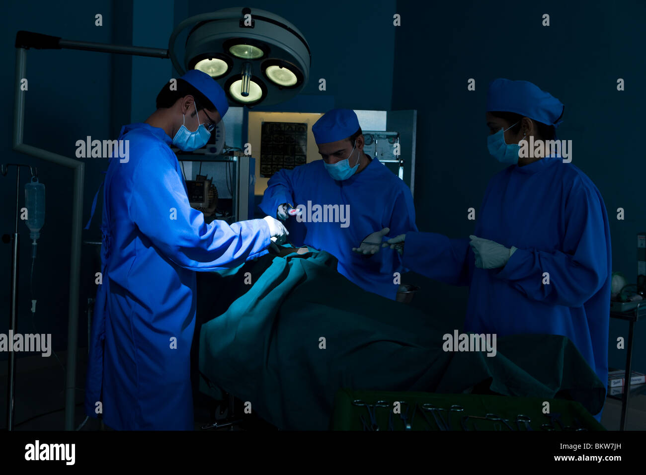 Surgical team doing operation patient hi-res stock photography and ...