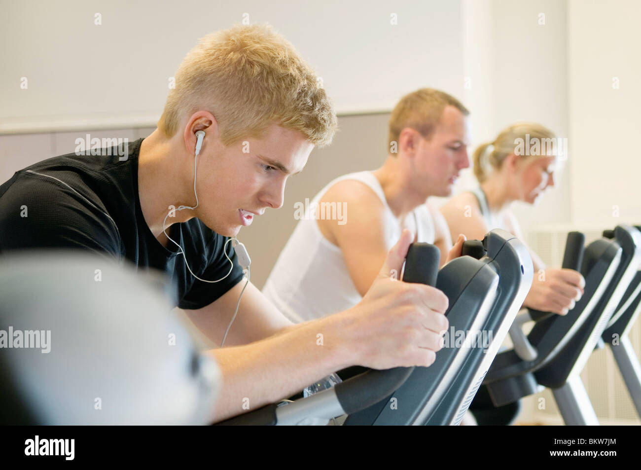Three people working out Stock Photo - Alamy