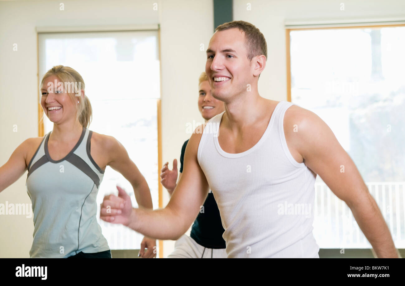 Three doing aerobics Stock Photo - Alamy