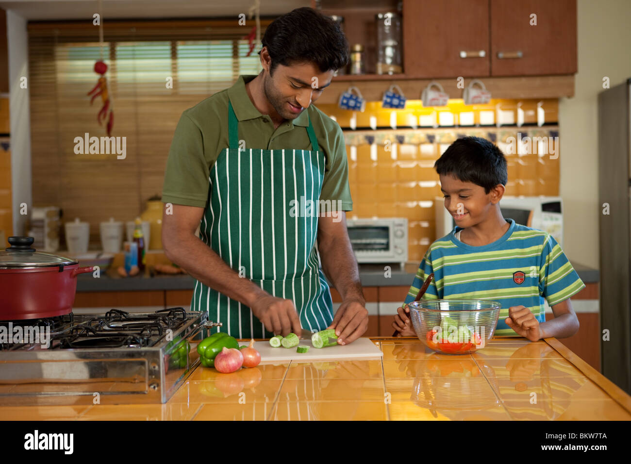 Father and son cooking in the kitchen Stock Photo - Alamy