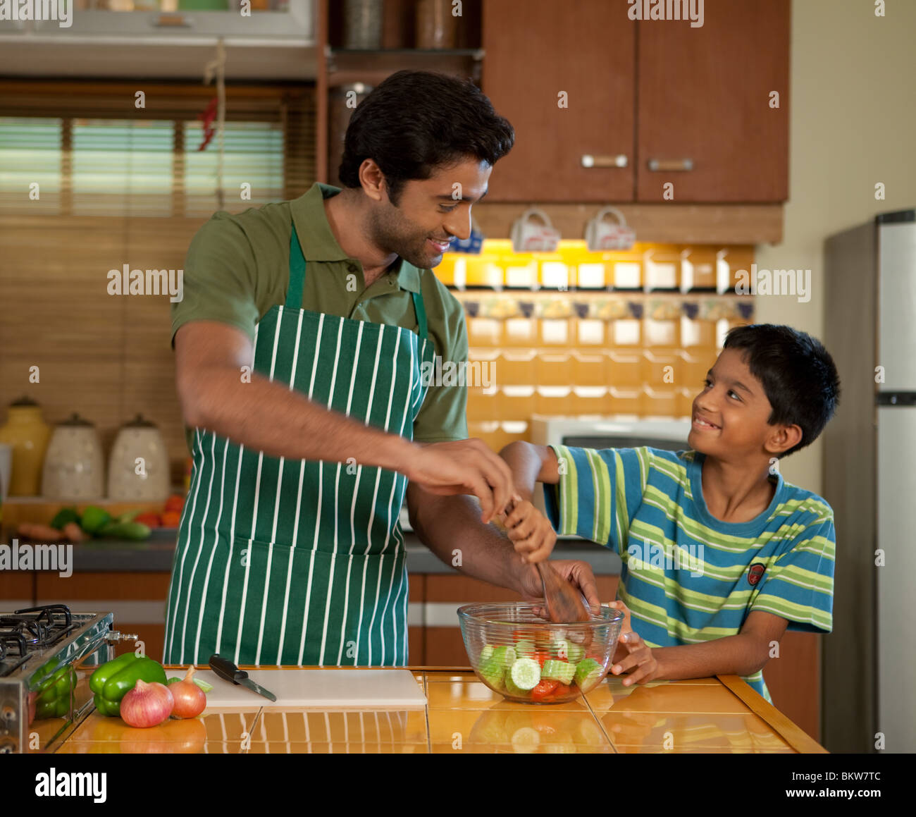 Father and son cooking in the kitchen Stock Photo - Alamy
