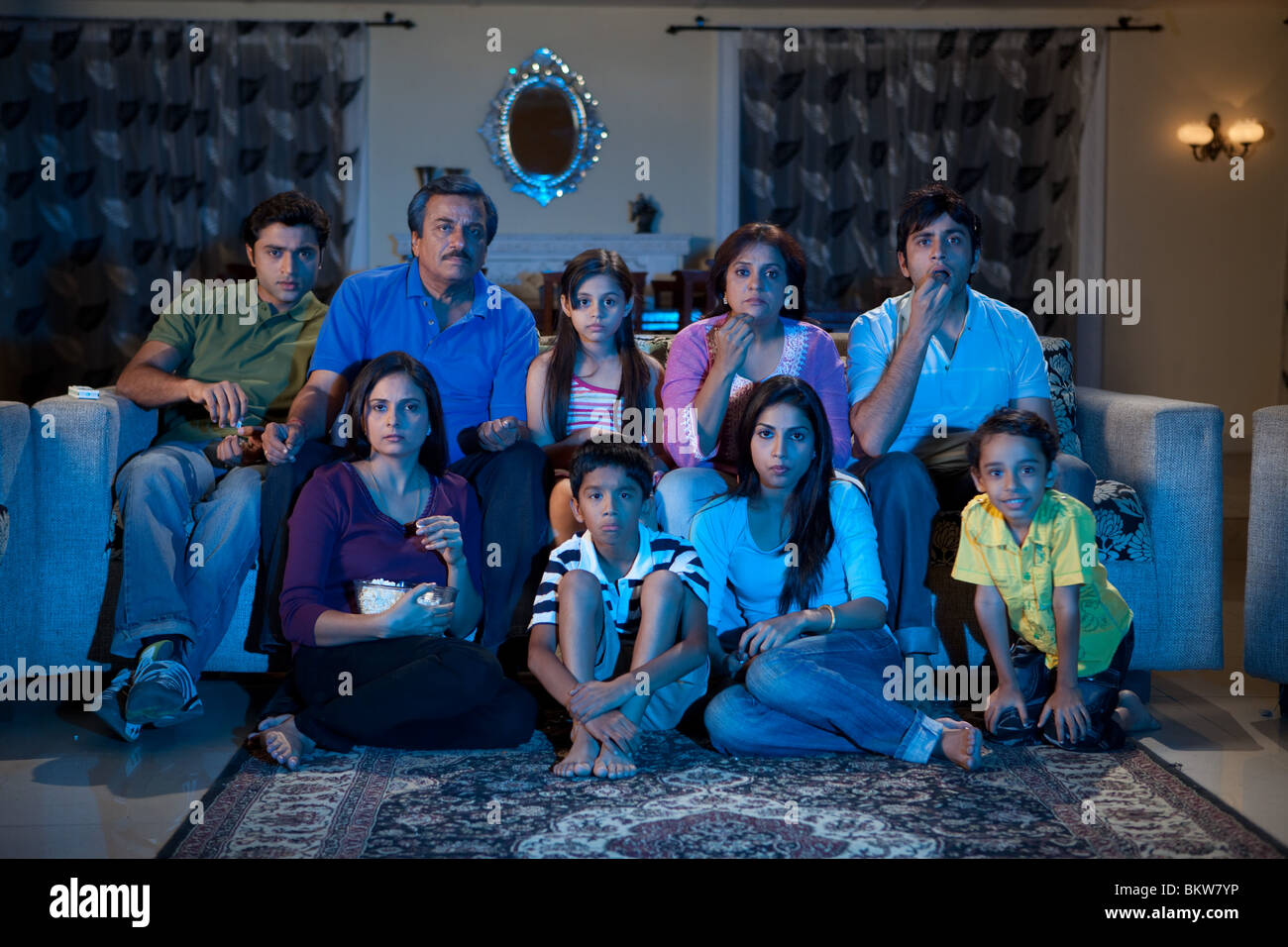 Three generation family watching television Stock Photo - Alamy