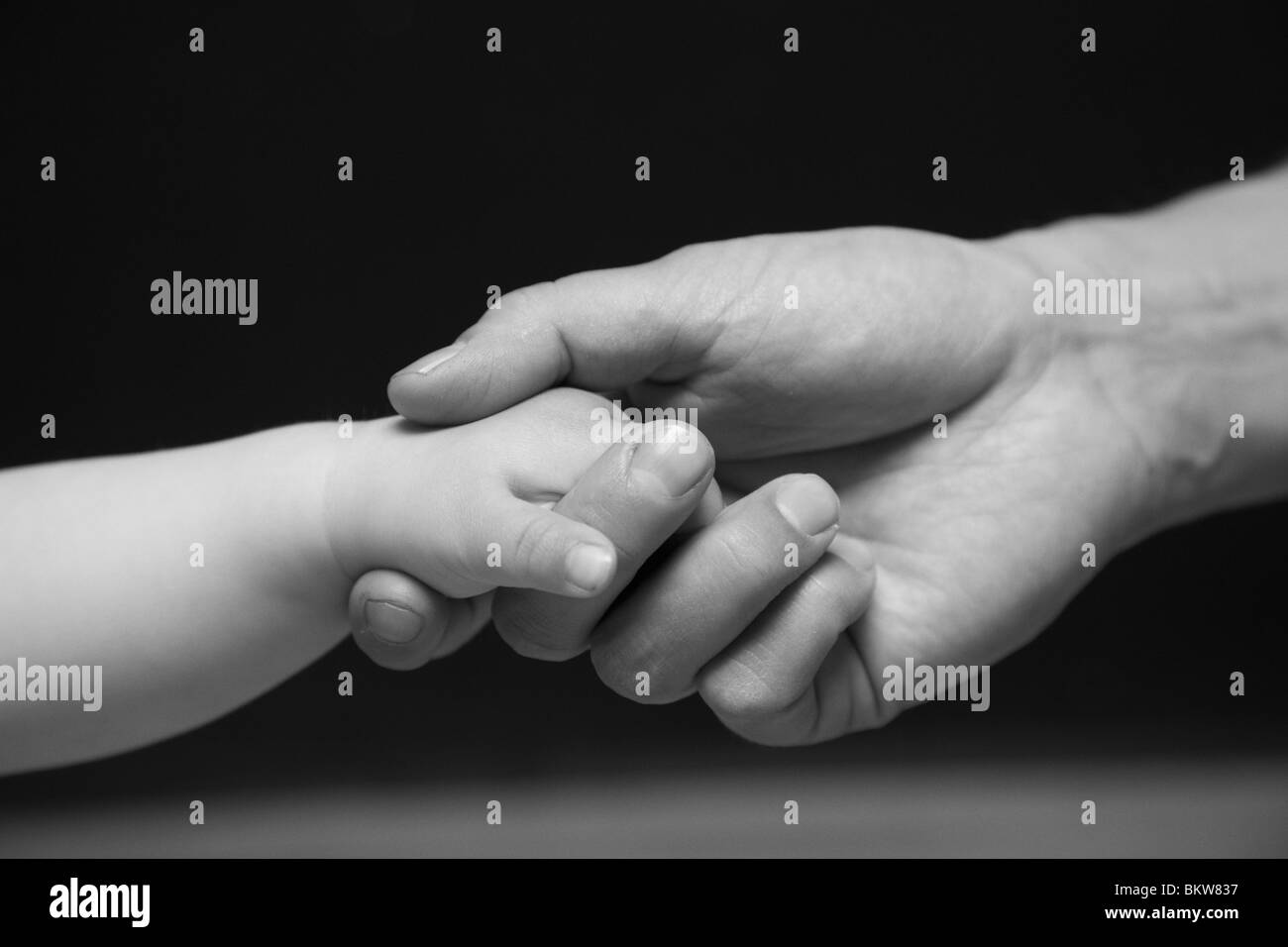 Two hands power Black and White Stock Photos & Images - Alamy