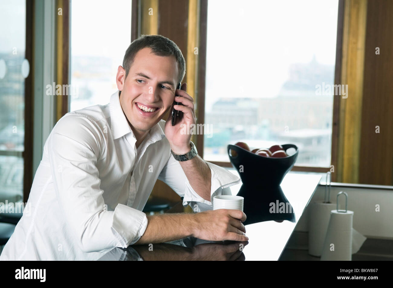 businessman by table Stock Photo - Alamy