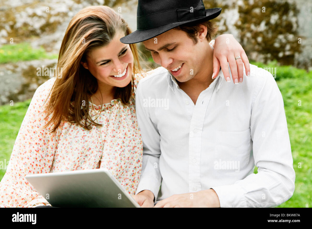 Friends with computer Stock Photo - Alamy