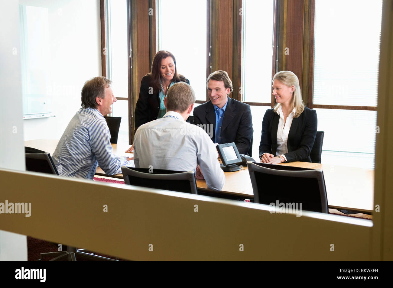 Small group in conference room Stock Photo - Alamy