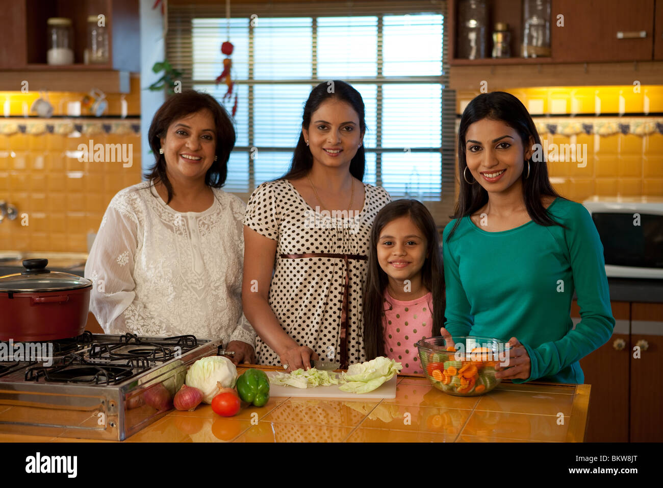 Portrait four happy family members hi-res stock photography and images ...