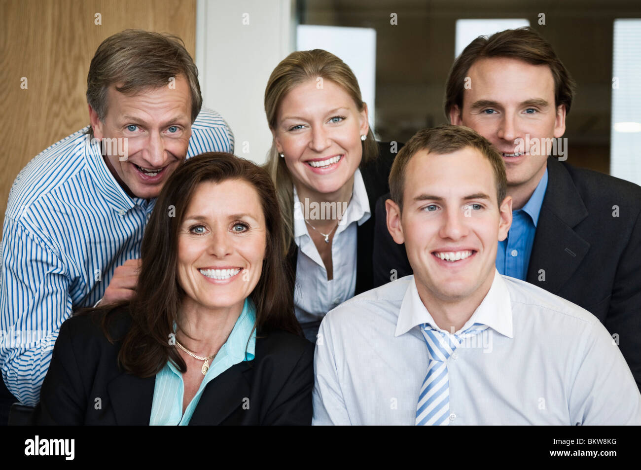 Five happy colleagues at work Stock Photo - Alamy