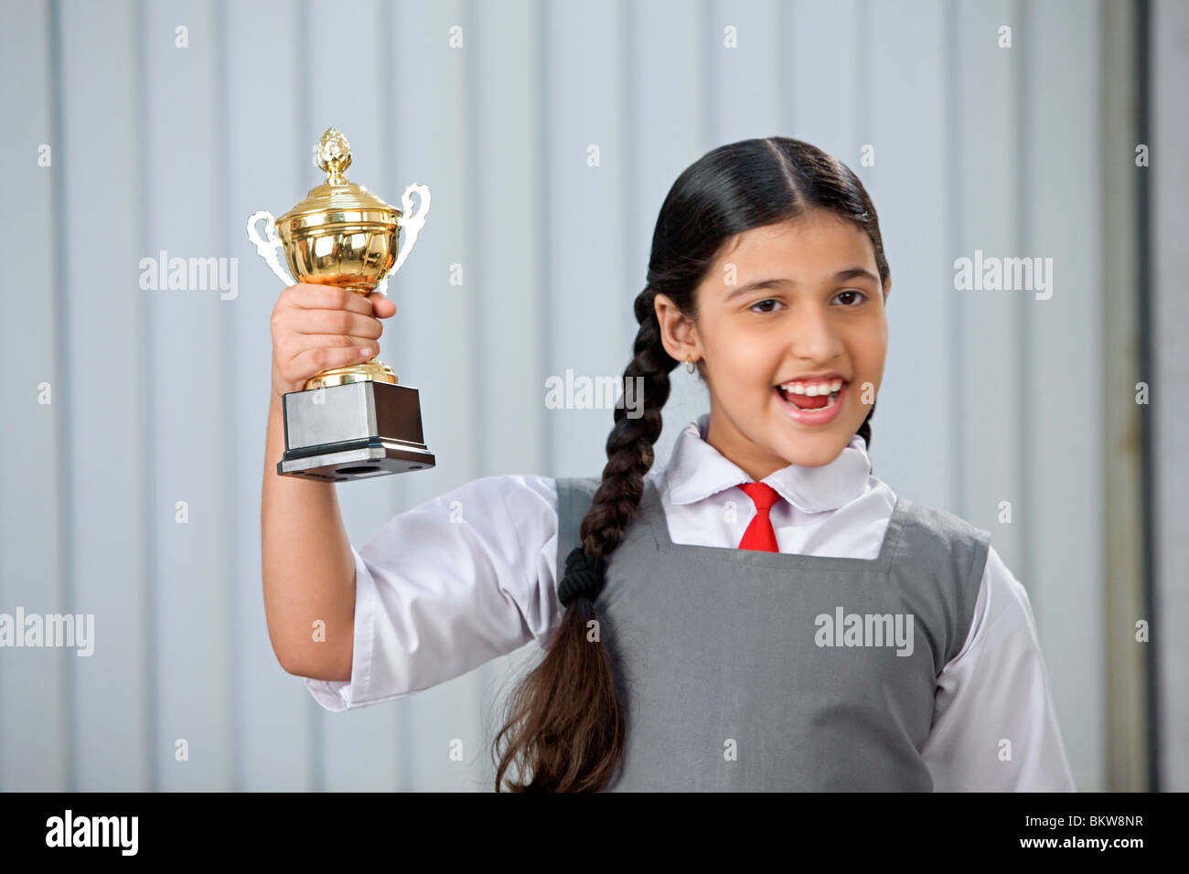 School girl holding trophy hi-res stock photography and images - Alamy