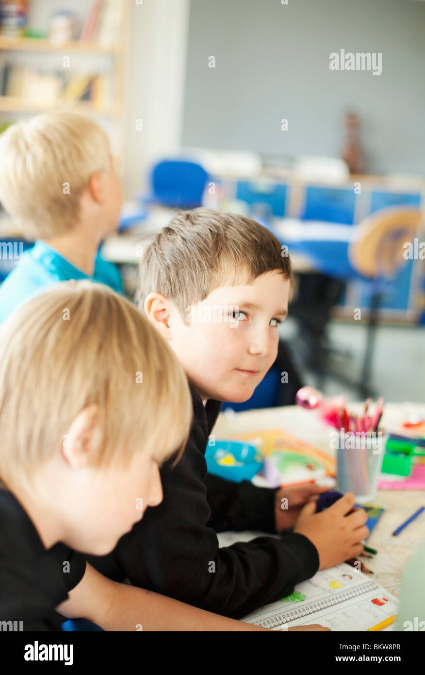 Three pupils in classroom hi-res stock photography and images - Alamy