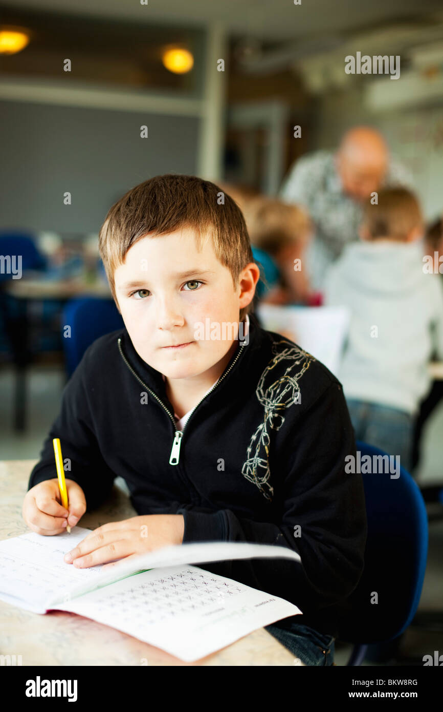 Boy writing with right hand hi-res stock photography and images - Alamy