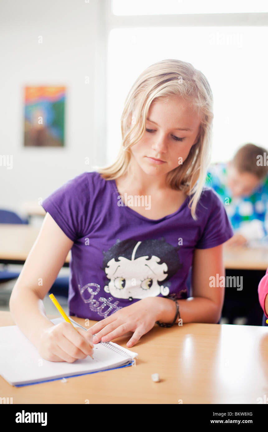 Girl 12 13 writing in notebook hi-res stock photography and images - Alamy