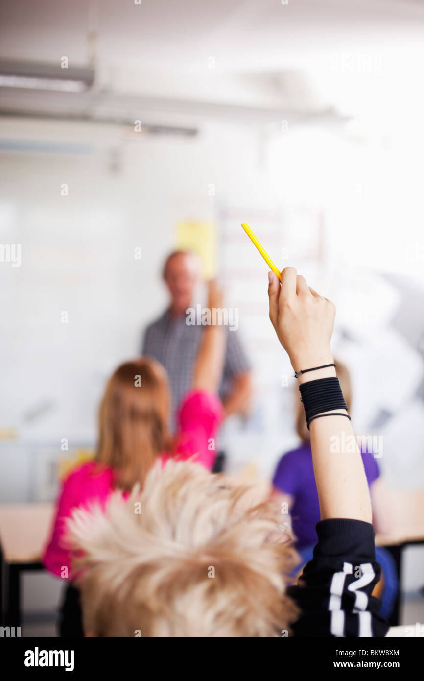 Middle school students raising hand hi-res stock photography and images ...