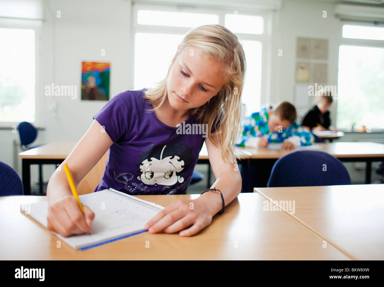 Girl 12 13 writing in notebook hi-res stock photography and images - Alamy
