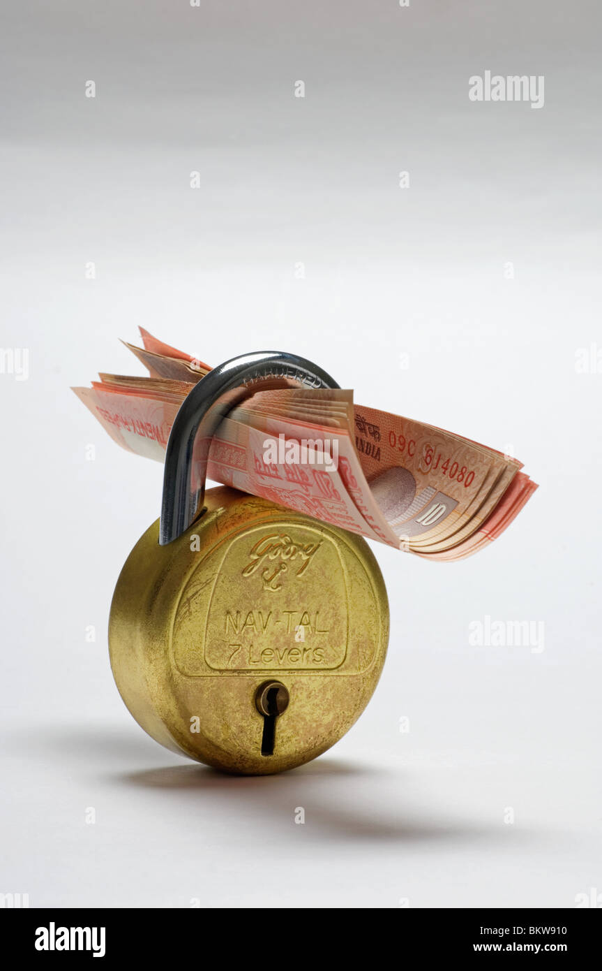Indian rupees bank notes and a lock Stock Photo - Alamy