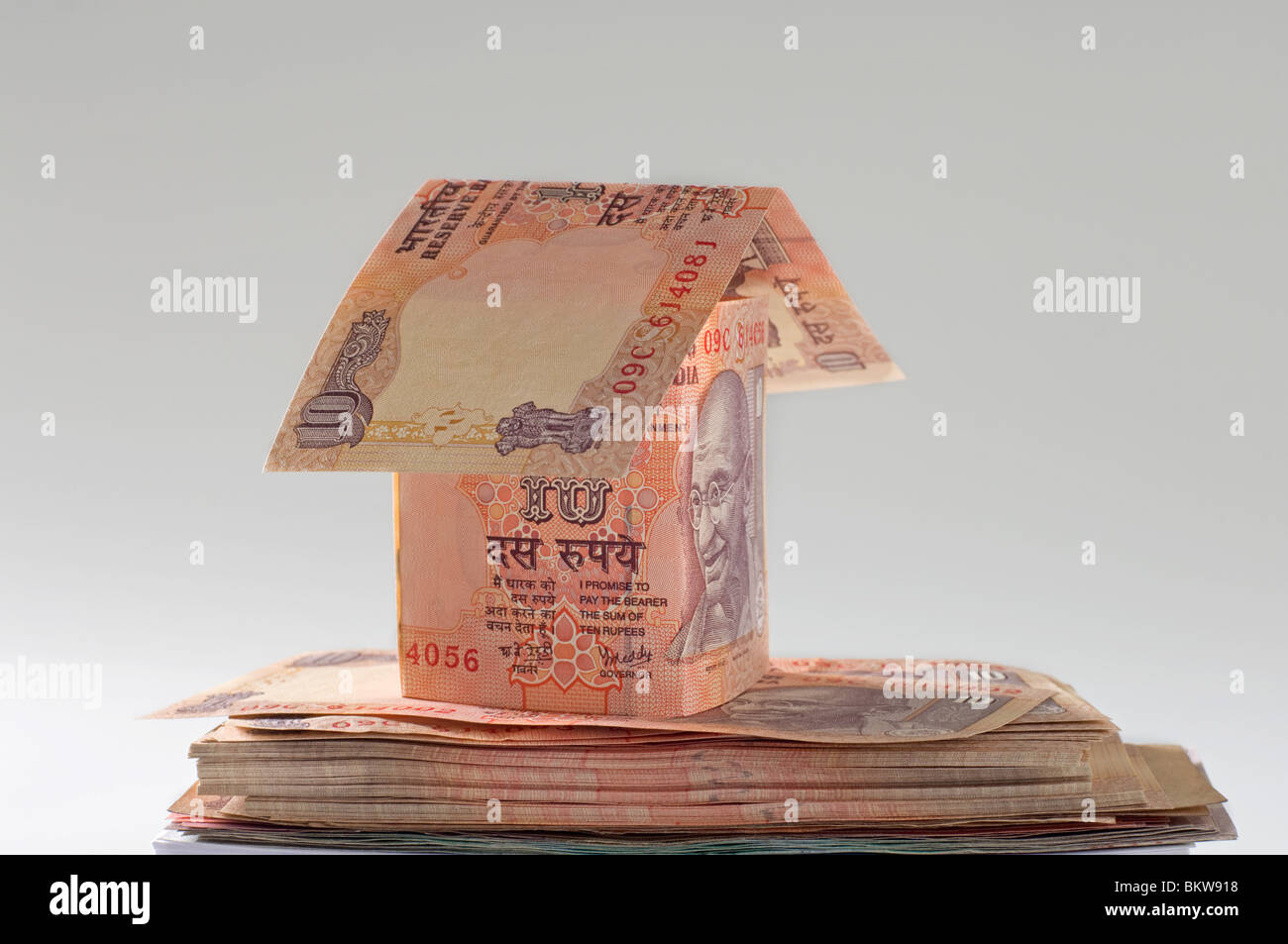 Indian rupee banknotes in a shape of house Stock Photo - Alamy